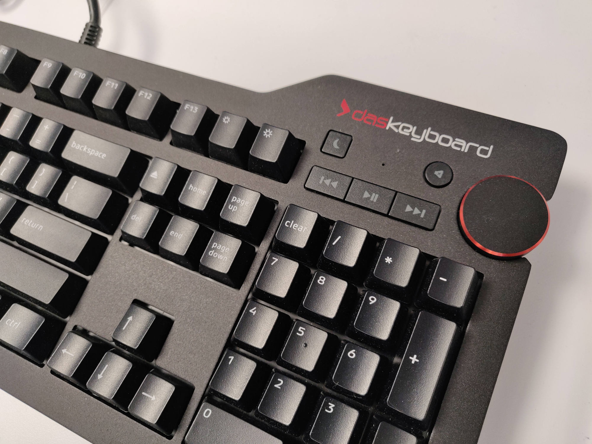 This large, chunky keyboard with an ugly wire sticking out of it is ...