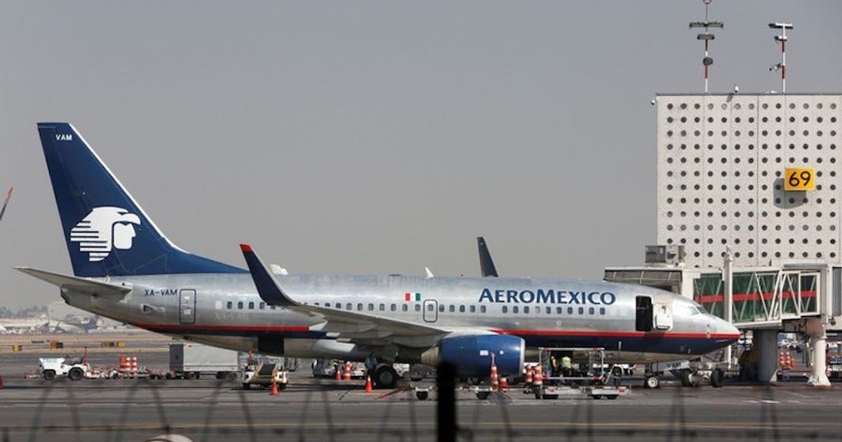 A man opened a plane's emergency exit and walked onto its wing after ...