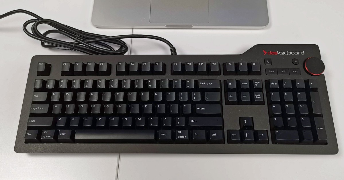 This large, chunky keyboard with an ugly wire sticking out of it is ...