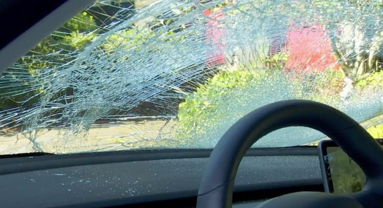 A Tesla Model 3's dash camera captured a man jumping on the hood and ...