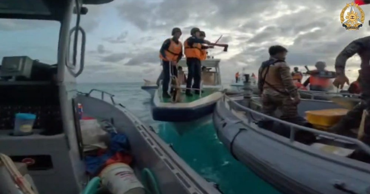 Video shows Chinese coast guard brandishing an ax in a low-tech clash ...