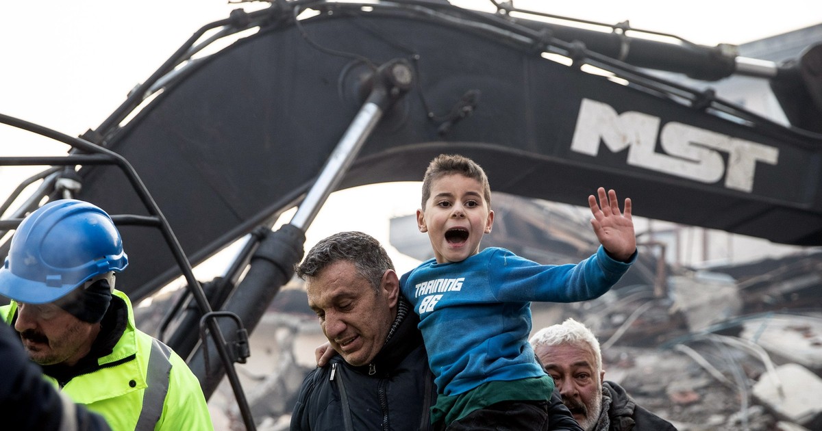 Photos show an 8-year-old boy pulled from the earthquake rubble in ...