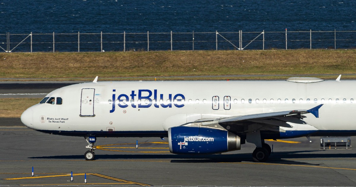 A JetBlue passenger opened the plane's emergency exit after reportedly ...