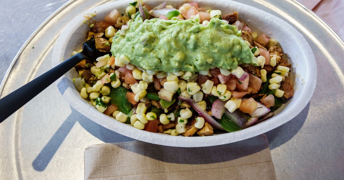 A woman who got dragged for bringing a big box of Chipotle takeout on ...