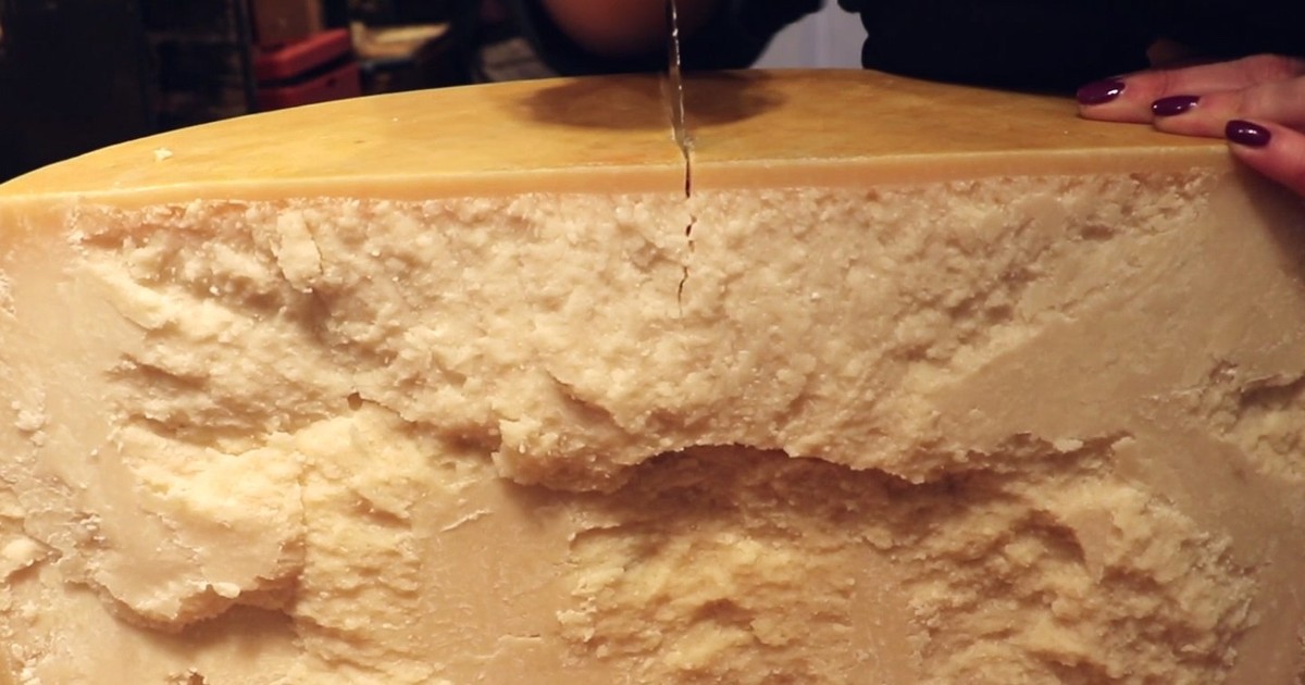 We visited a certified parmesan cheese factory in Italy where 88-pound ...