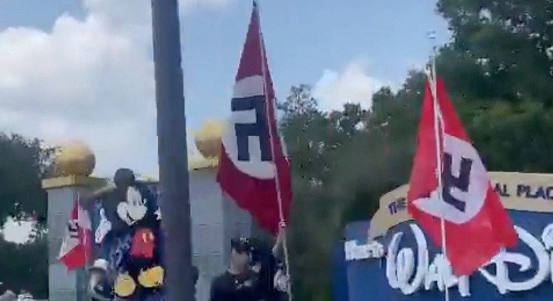 Protesters carrying Nazi flags and DeSantis imagery gathered outside ...